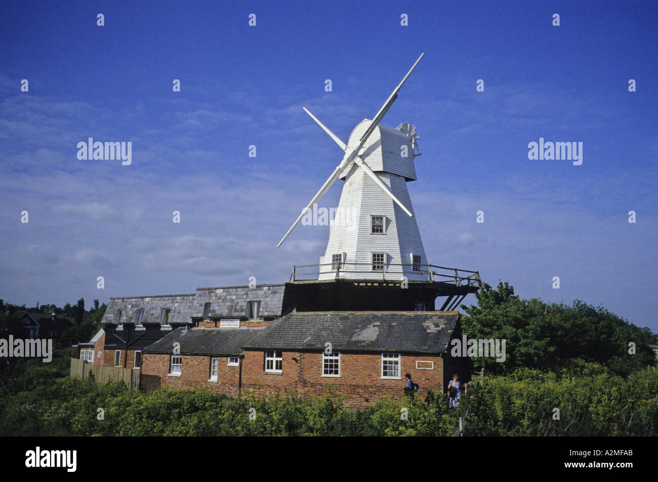A traditional windmill on a summers day in Rye East Sussex against a ...