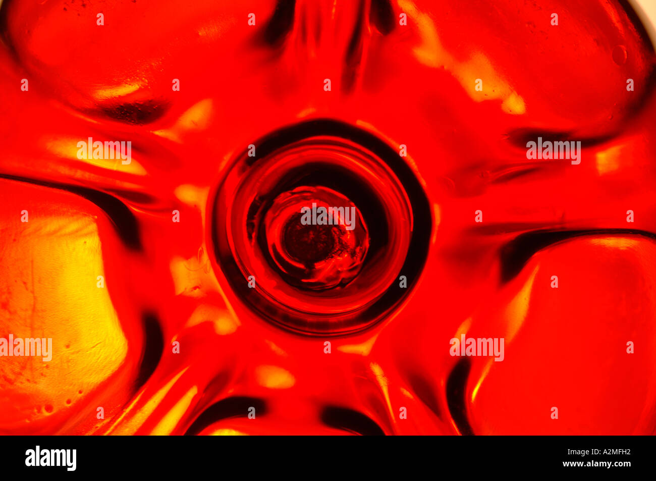 Bottom Of A Red Plastic Bottle Stock Photo - Alamy