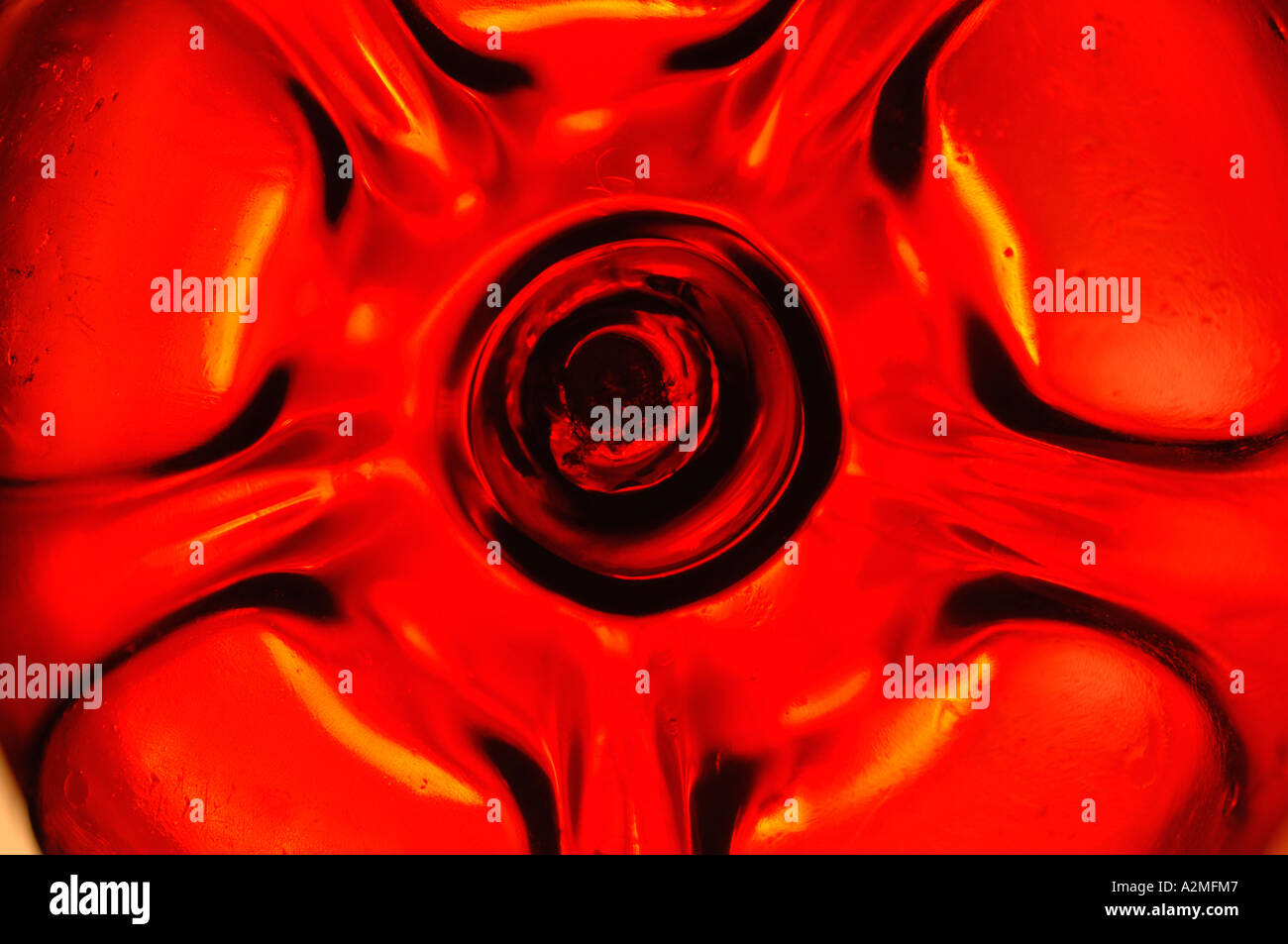 Bottom Of A Red Plastic Bottle Stock Photo - Alamy