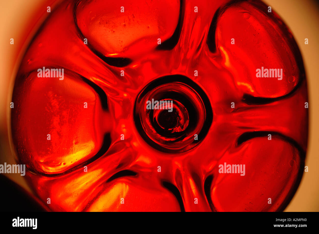Bottom Of A Red Plastic Bottle Stock Photo - Alamy