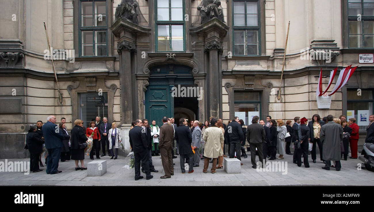 group of people waiting in front of a door Stock Photo - Alamy