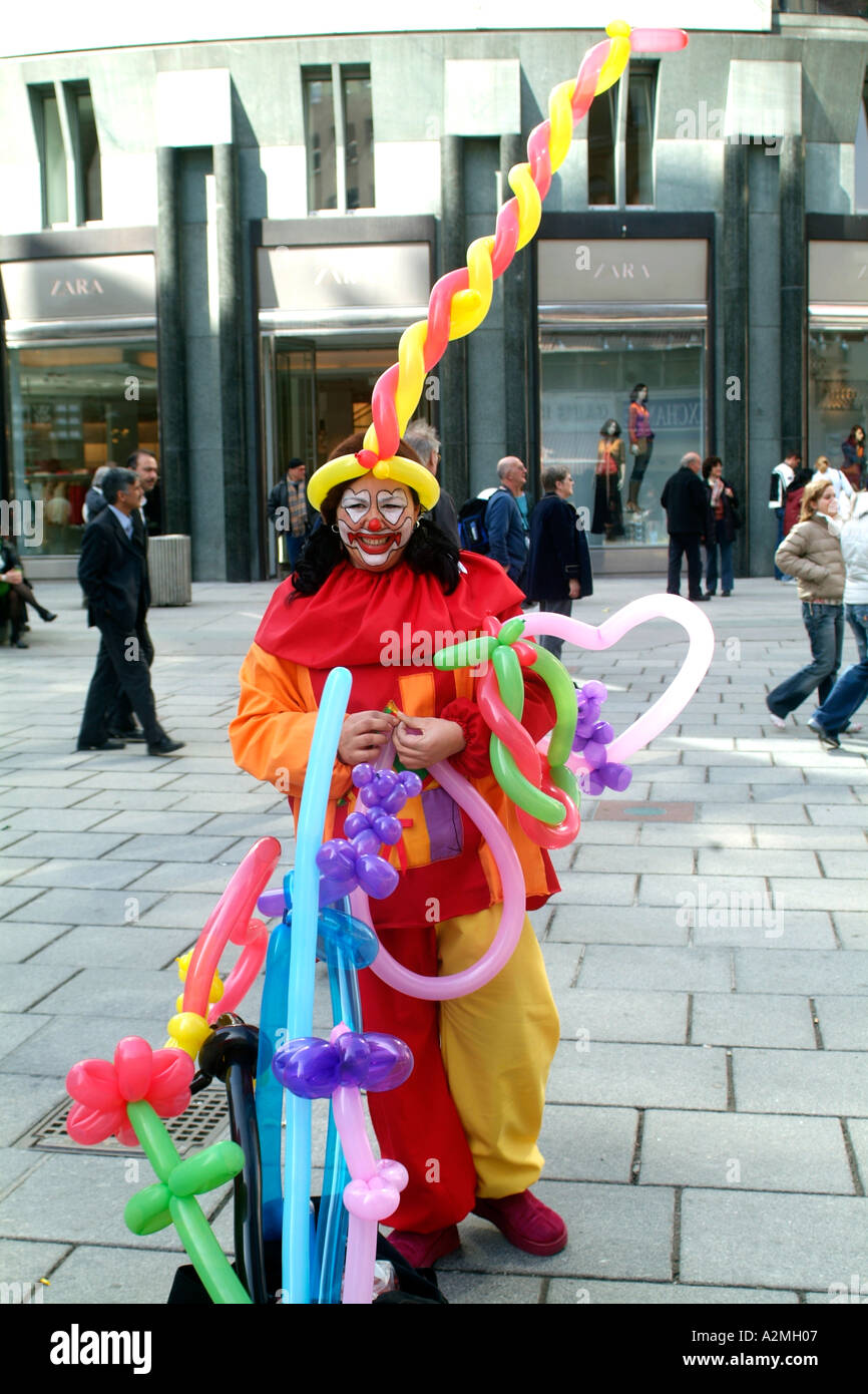 A street clown makes bendy toys from balloons in Vienna's city center ...
