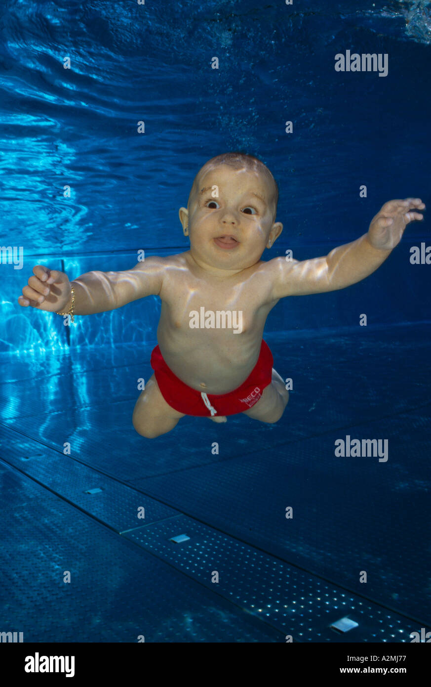 baby diving in pool Stock Photo - Alamy