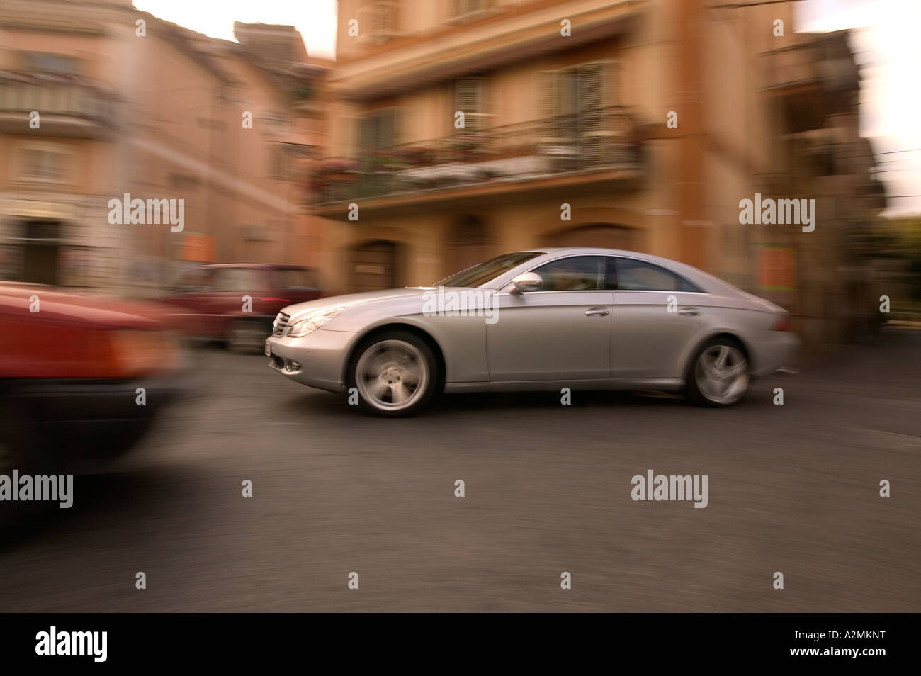 Car driving through toen square in Italy Stock Photo - Alamy