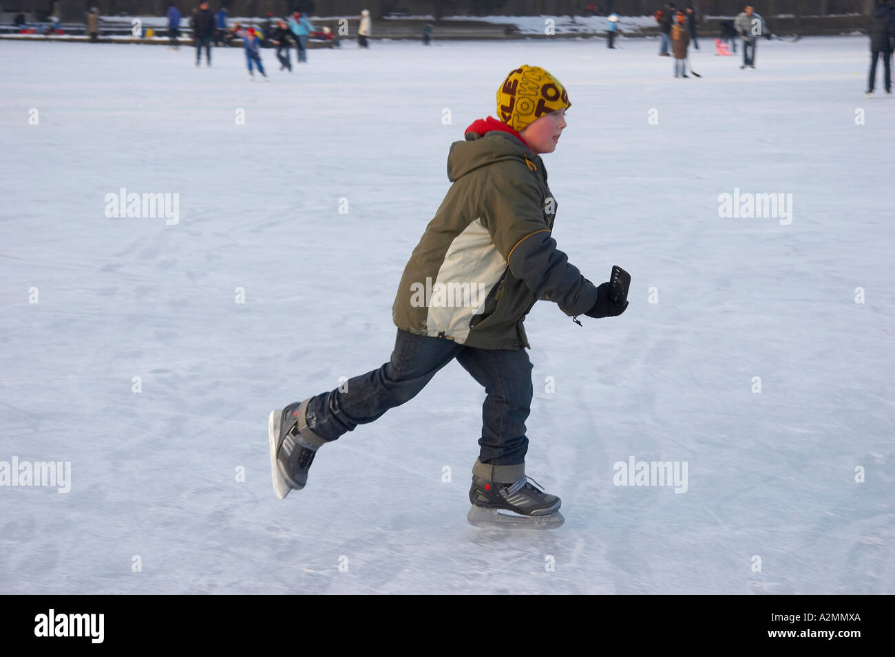 Child ice skating hi-res stock photography and images - Alamy