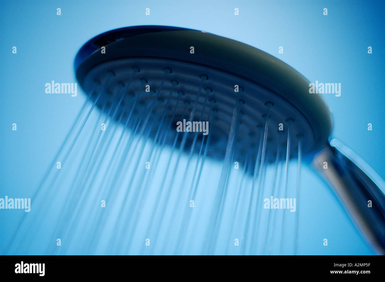 SHOWER HEAD WATER SPRAYING OUT OF IN BATHROOM Stock Photo - Alamy