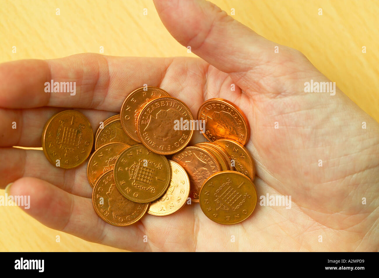 Pennies in hand hi-res stock photography and images - Alamy