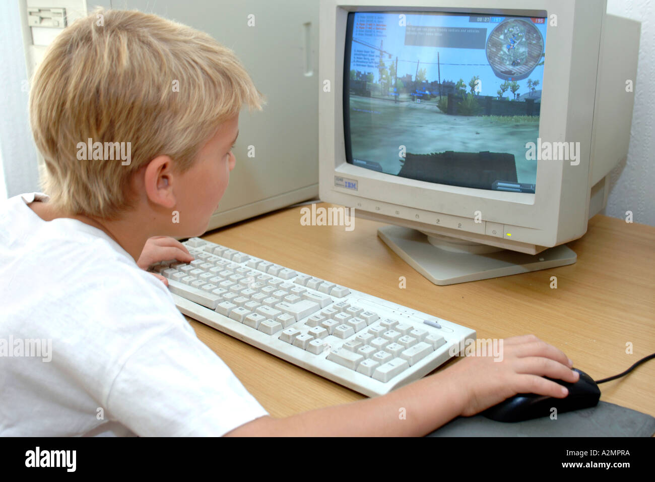 A 6-year old boy playing a computer game Stock Photo - Alamy