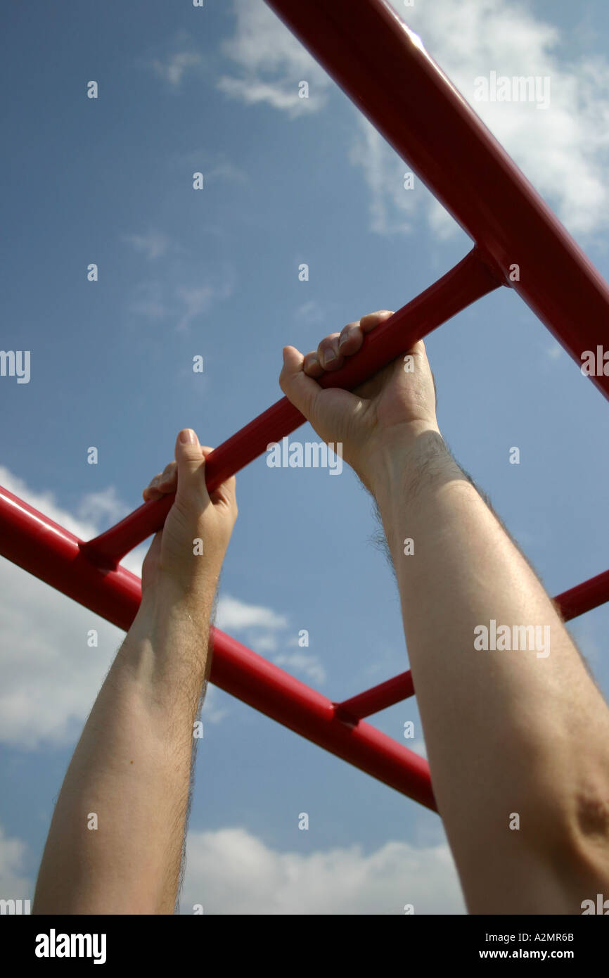Man monkey bars playground hi-res stock photography and images - Alamy