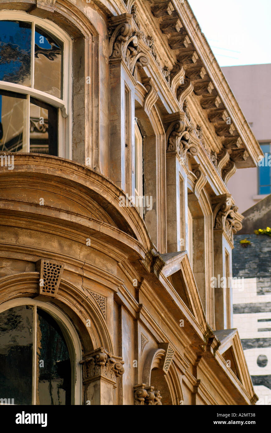 Yellow sandstone building elevation with windows Stock Photo - Alamy