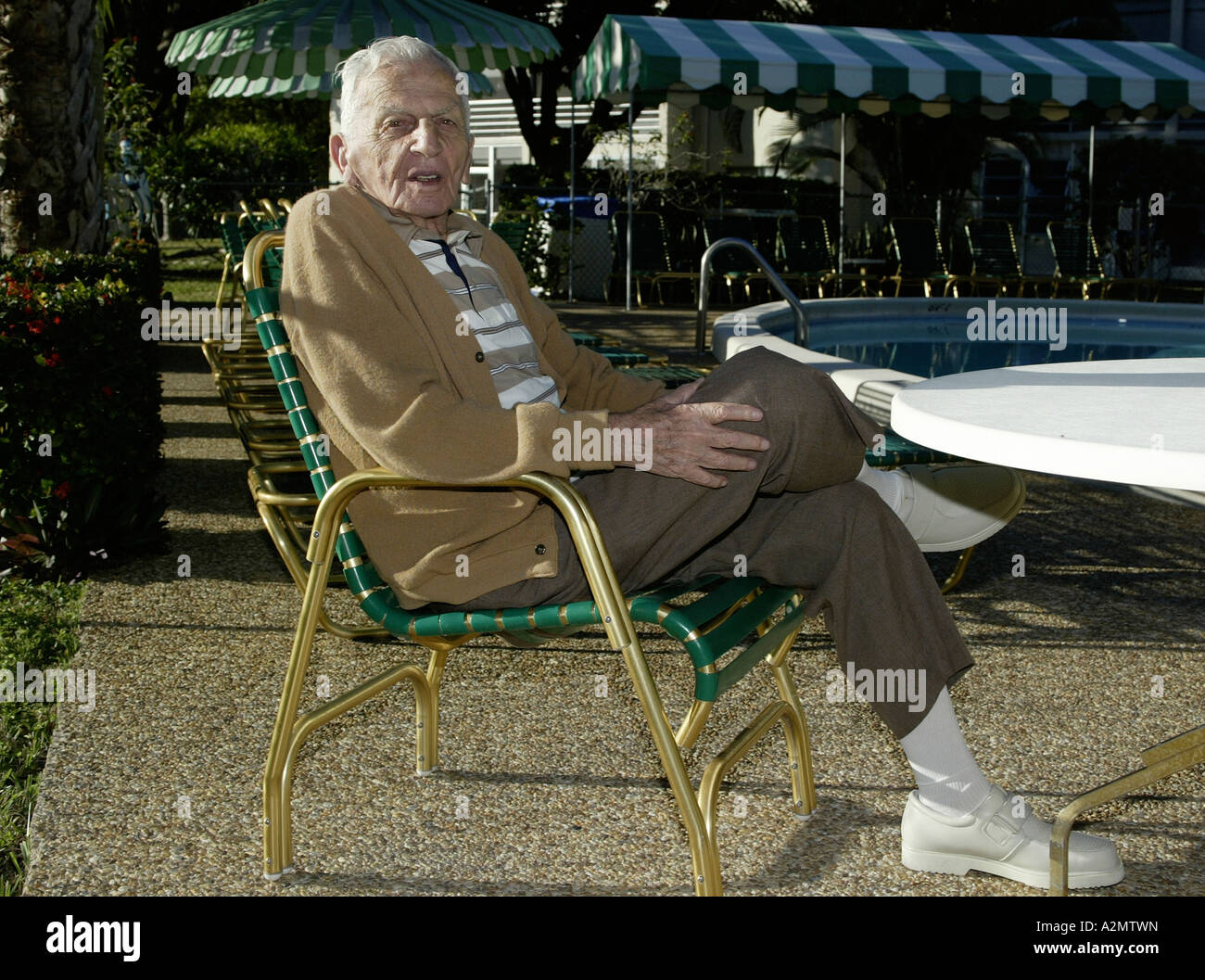 Senior citizen sitting in a chair Stock Photo - Alamy