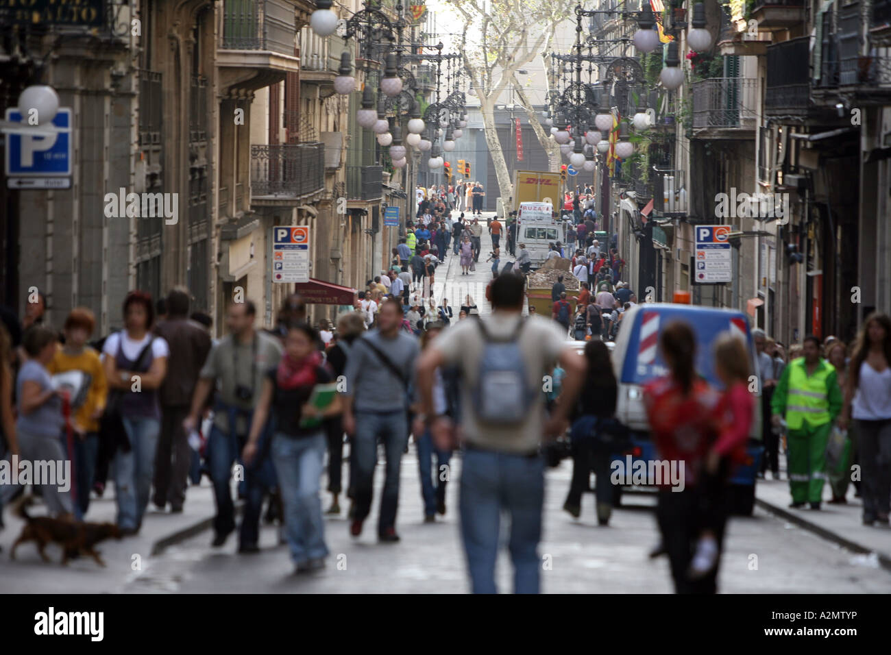 Tourists stroll down a street in Barcelona Spain Europe Stock Photo - Alamy