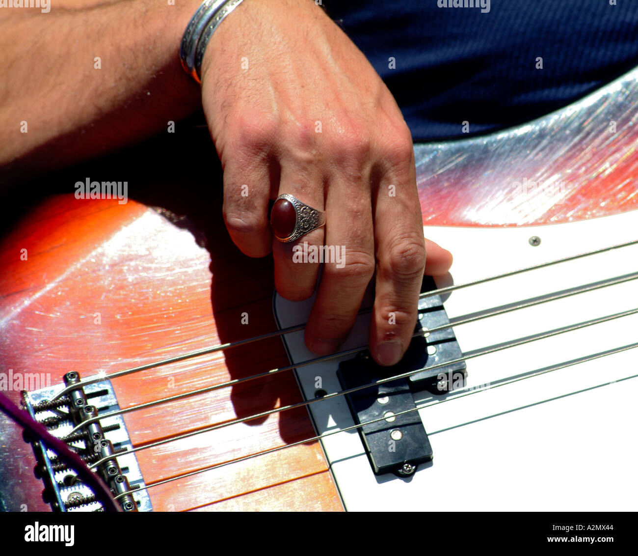 Close up of hand on the frets of an electric bass guitar Stock Photo ...