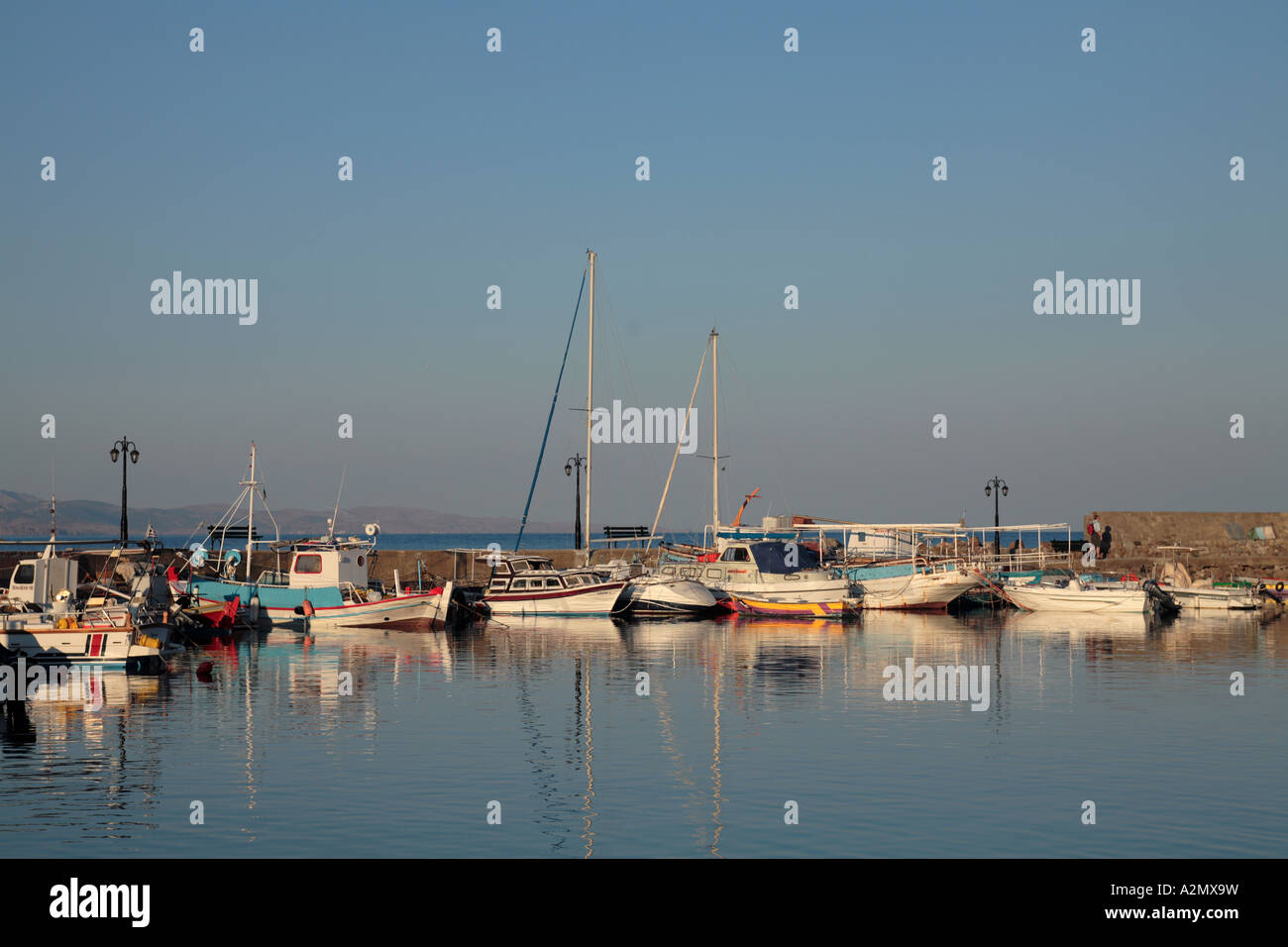 long line of moored fishing boats in harbor Stock Photo - Alamy