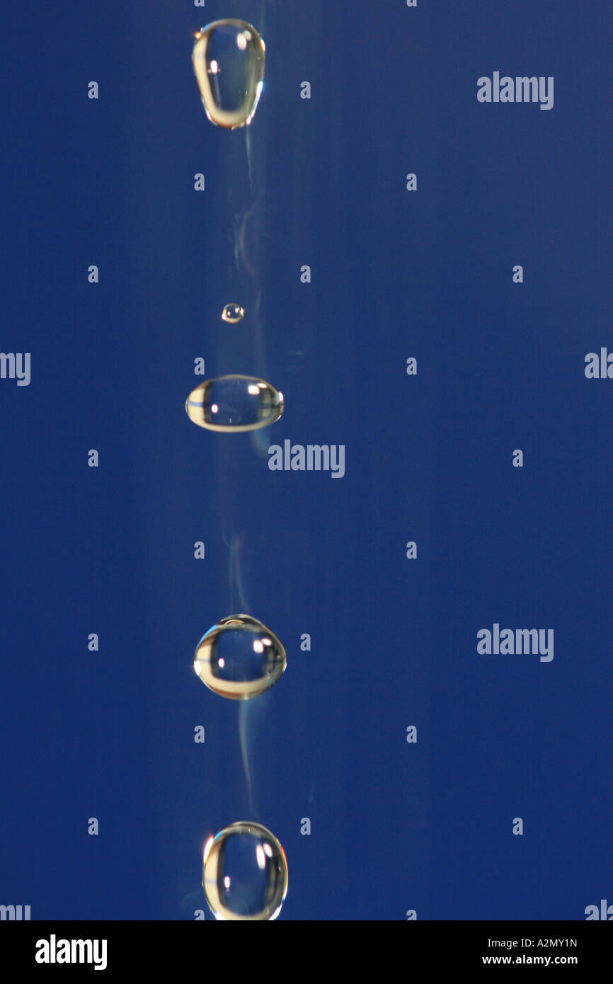 Water drops falling from tap Stock Photo - Alamy
