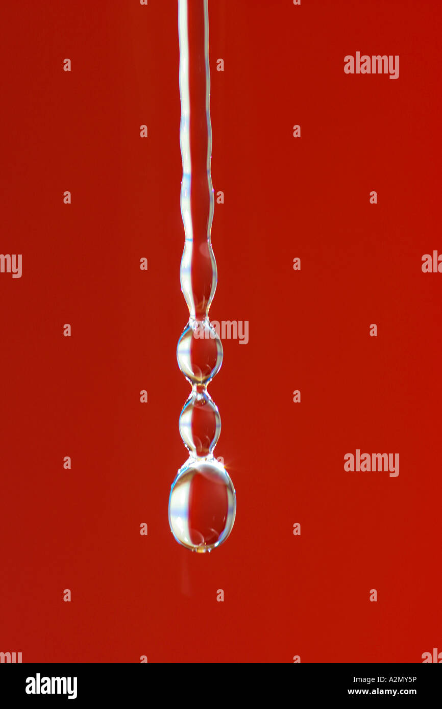 Water drops falling from tap Stock Photo - Alamy