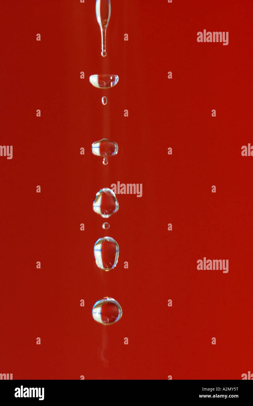 Water drops falling from tap Stock Photo - Alamy