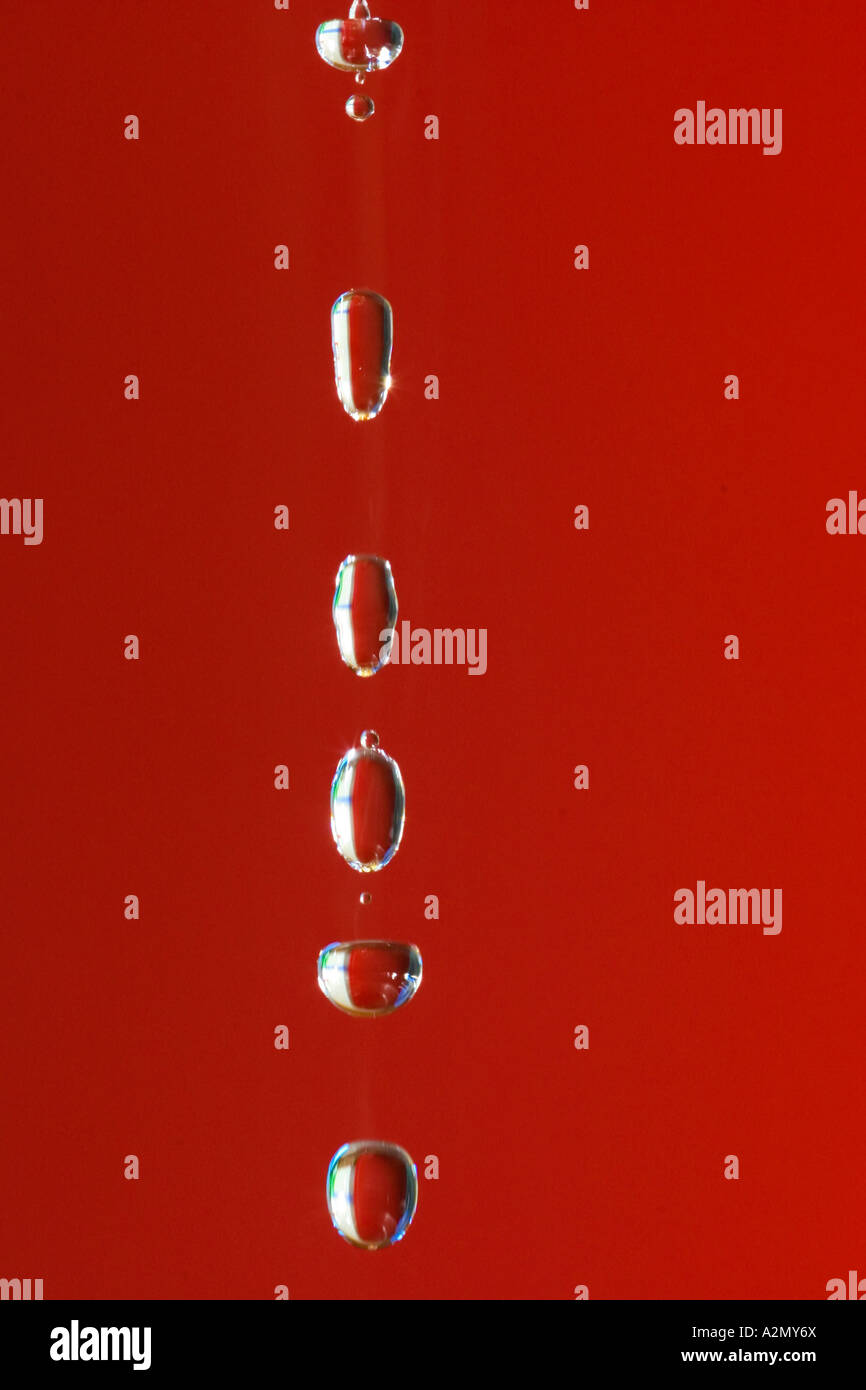 Water drops falling from tap Stock Photo - Alamy