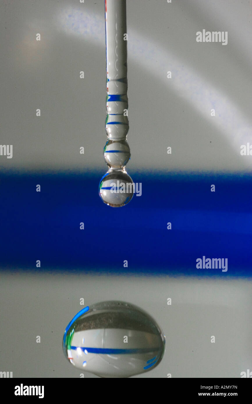Water drops falling from tap Stock Photo - Alamy