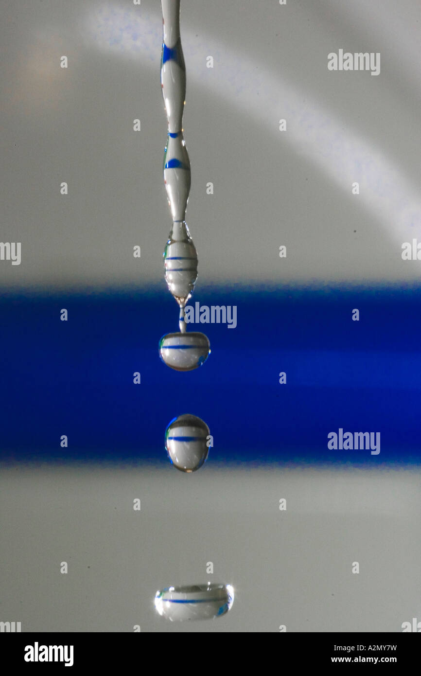 Water drops falling from tap Stock Photo - Alamy
