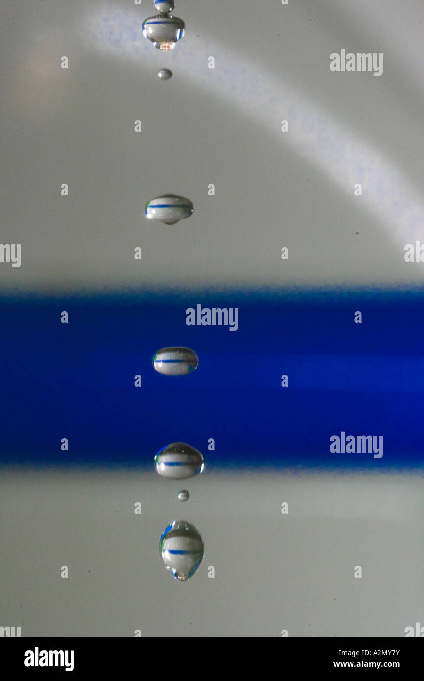 Water drops falling from tap Stock Photo - Alamy