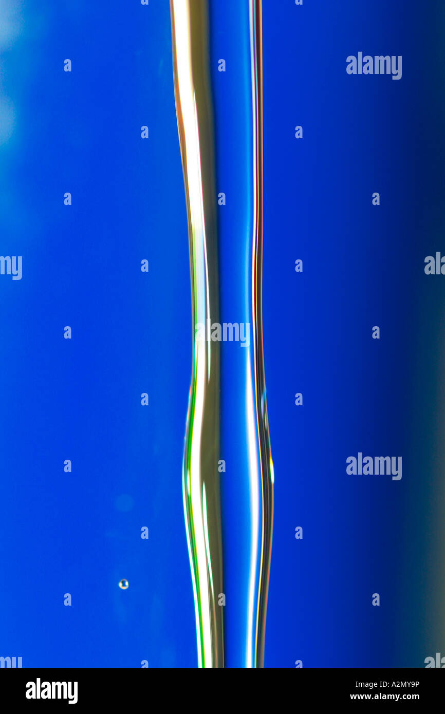 Water column and drops falling from tap Stock Photo - Alamy