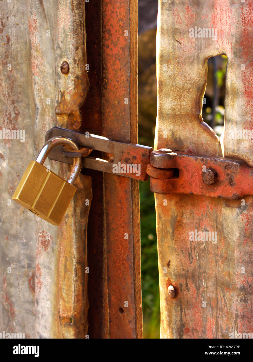 Close up view of latch and lock on old galvanised gate Stock Photo - Alamy