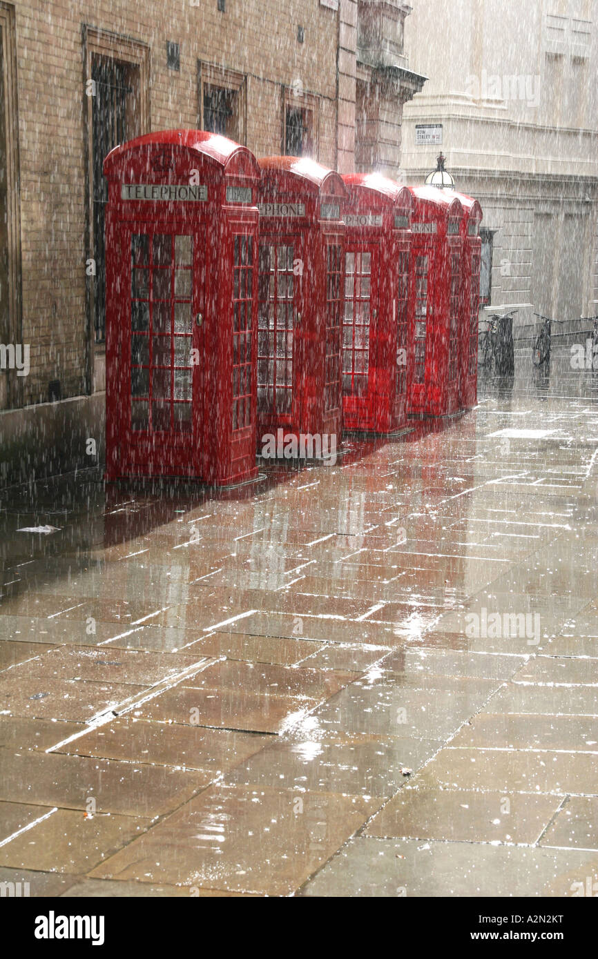 Red Telephone boxes in the rain in Covent Garden London Stock Photo - Alamy