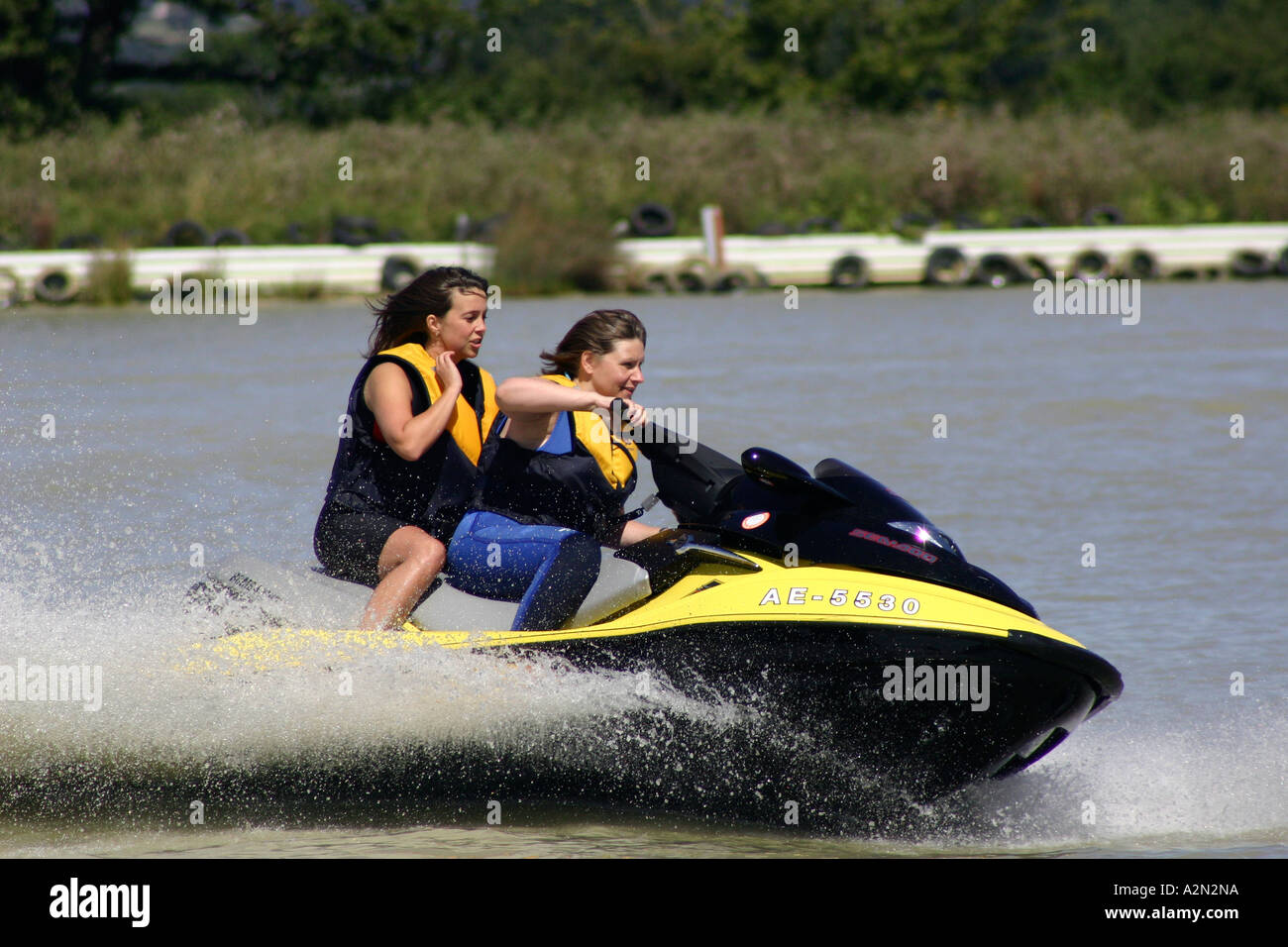 Girls on Jetski Stock Photo - Alamy