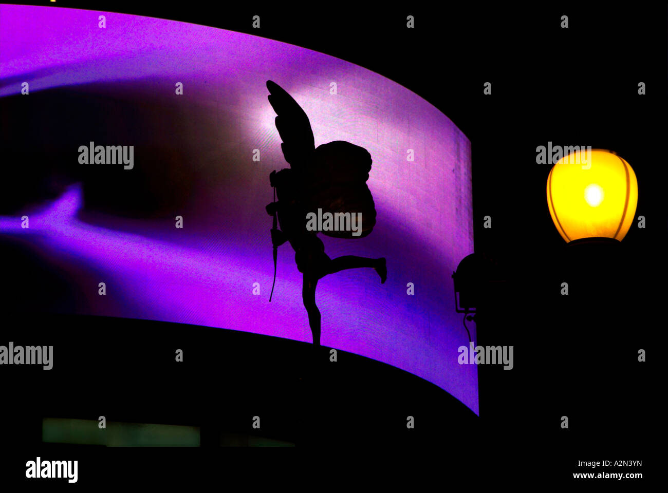 Silhouette of Eros sign at night, Piccadilly Circus, London, England ...