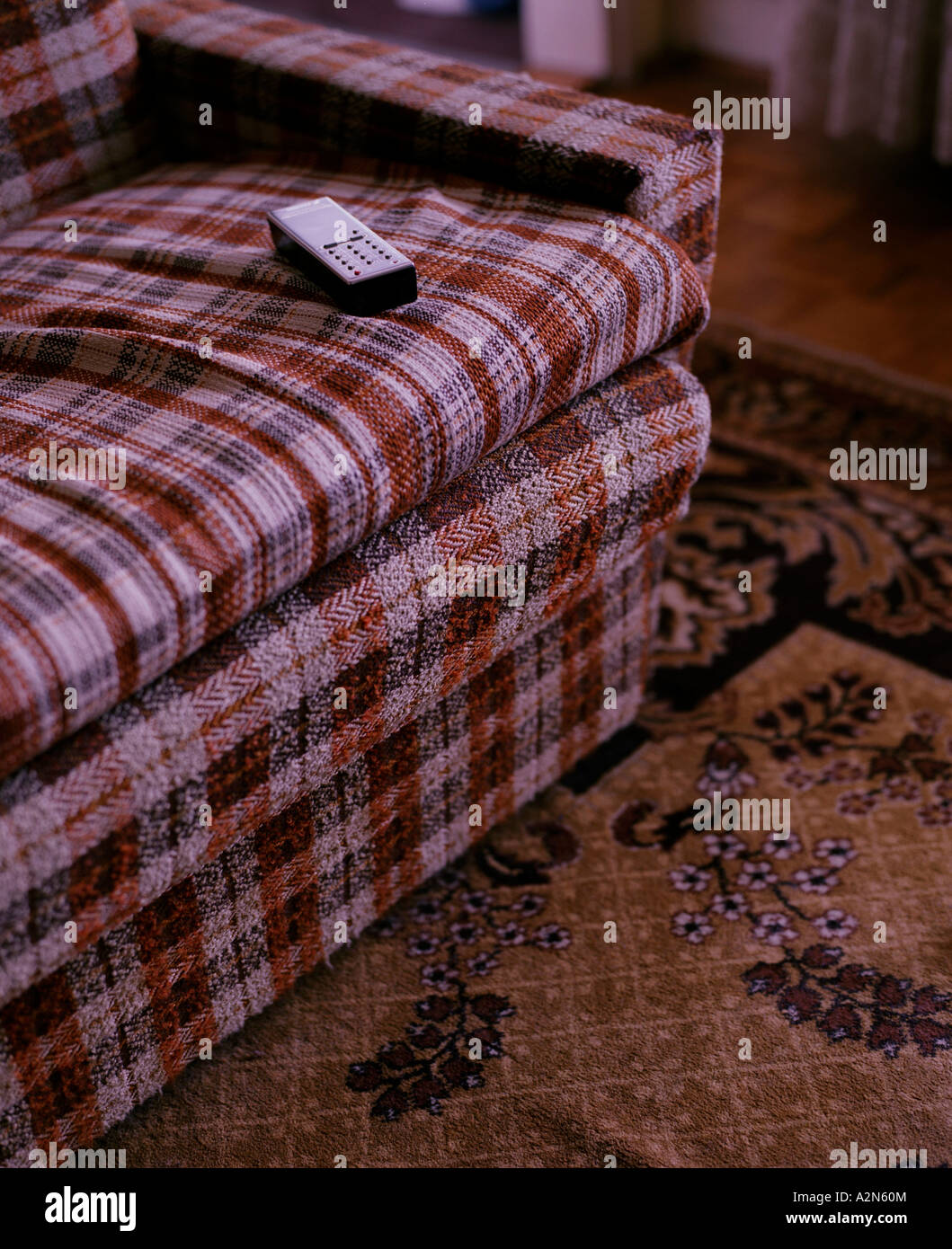 Remote control of television on couch Stock Photo - Alamy