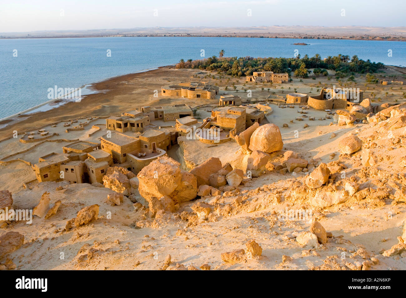 High angle view of old ruins of resort at waterfront, Adrere Amellal ...