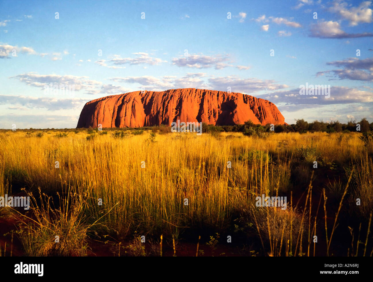 Rock formations on landscape, Uluru, Uluru-Kata Tjuta National Park ...