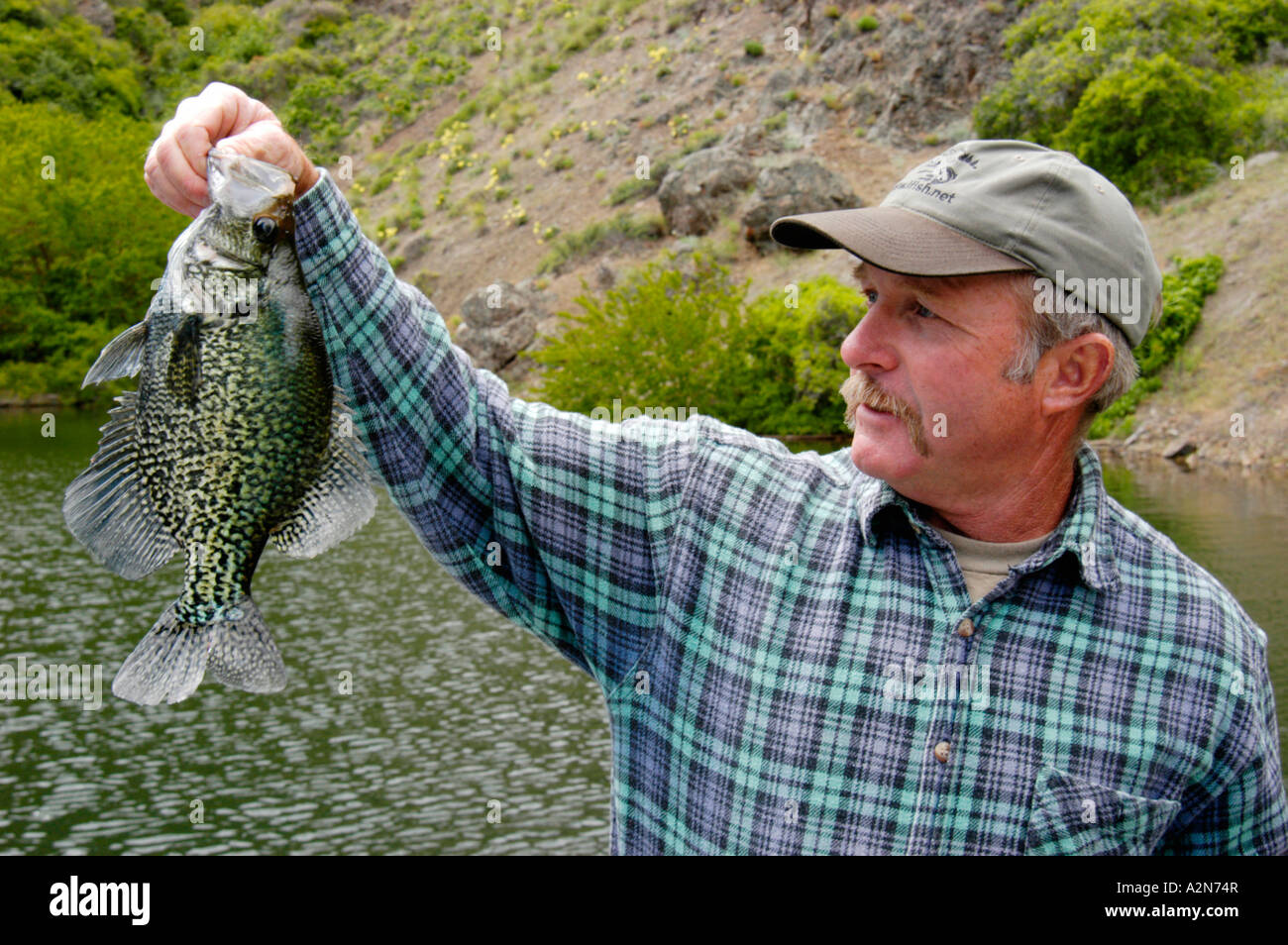 Guide Gary Gorbet with a large Crappie Stock Photo - Alamy