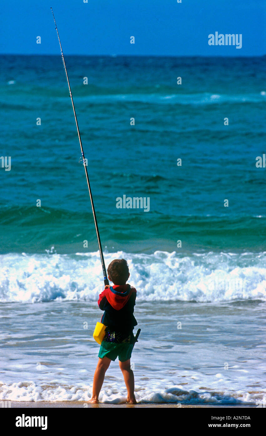 Young boy surf fishing with large rod Fraser Island Queensland ...