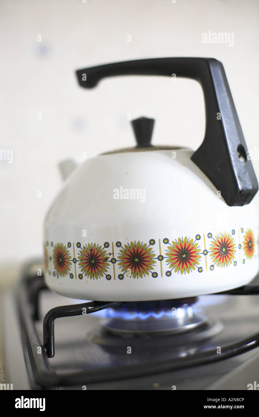 tea pot on a gas oven Stock Photo - Alamy