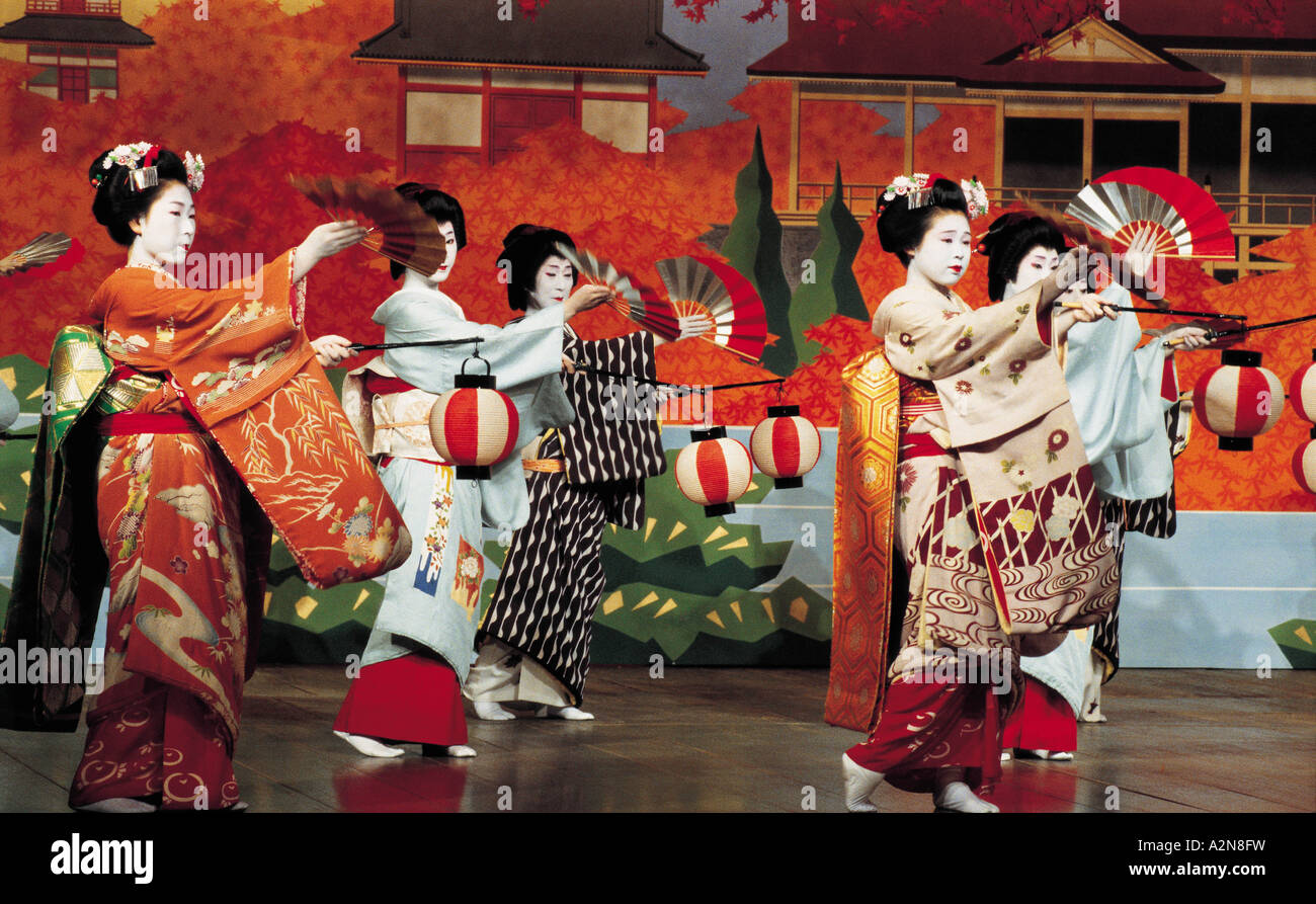 Group of women in traditional clothing performing on stage Stock Photo ...