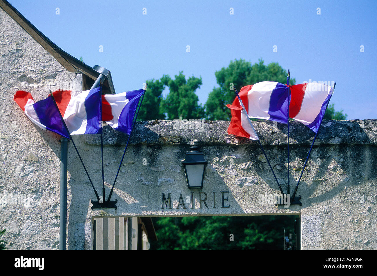 French flags at entrance of building, France Stock Photo - Alamy