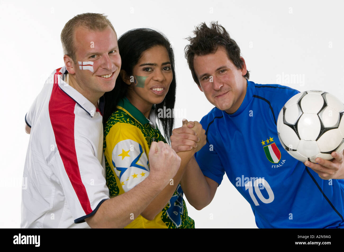 Portrait of three soccer fans cheering Stock Photo - Alamy