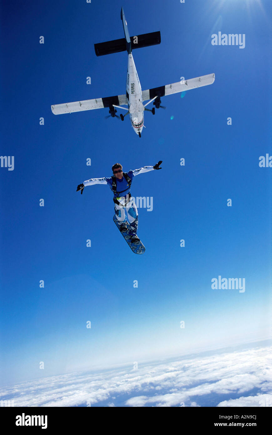 Man jumping from airplane Stock Photo - Alamy