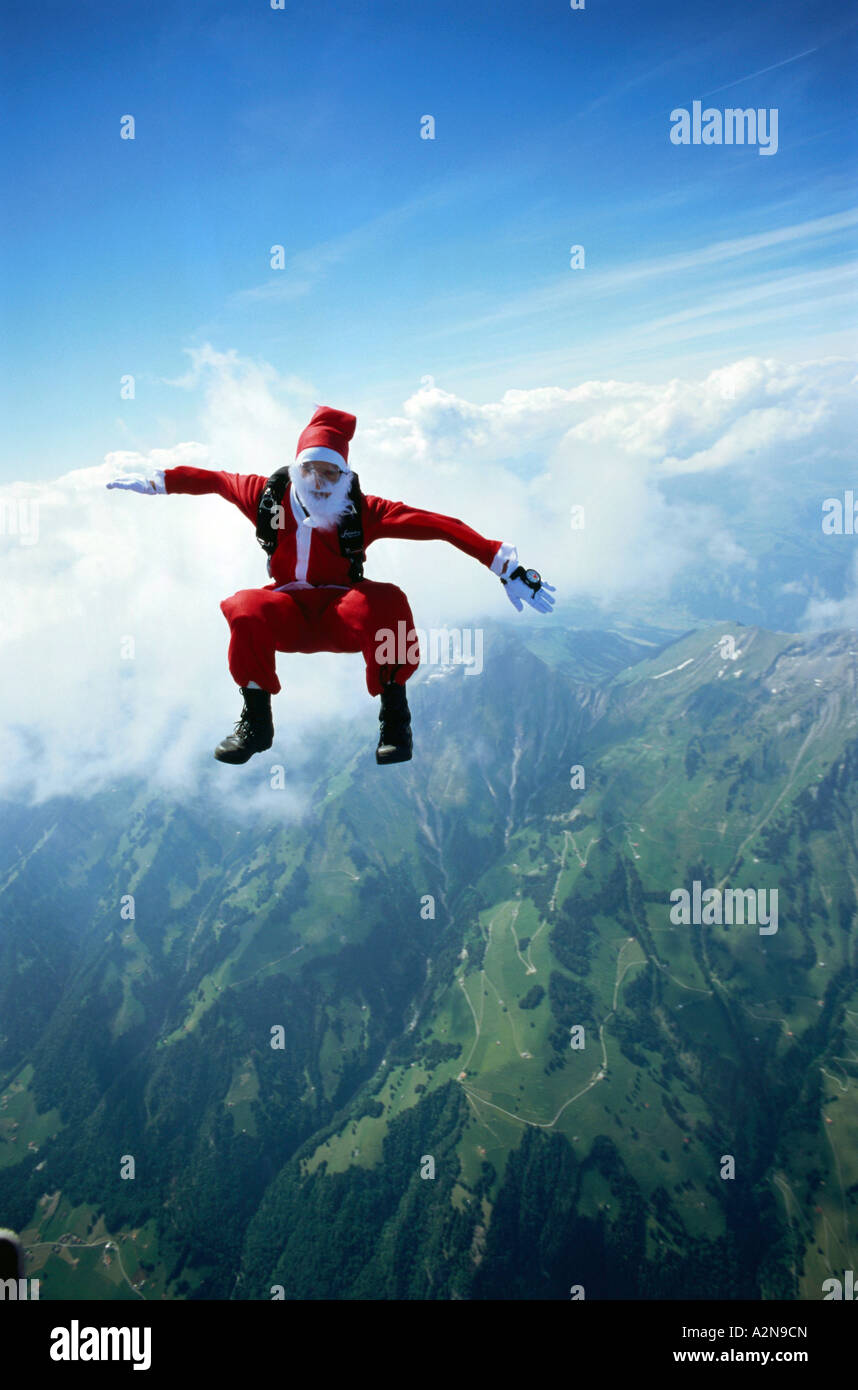 Skydiver in Santa Claus costume falling down towards ground Stock Photo ...