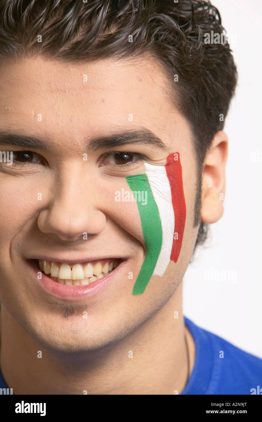 Portrait of young man with Italian painted flag on his face Stock Photo ...