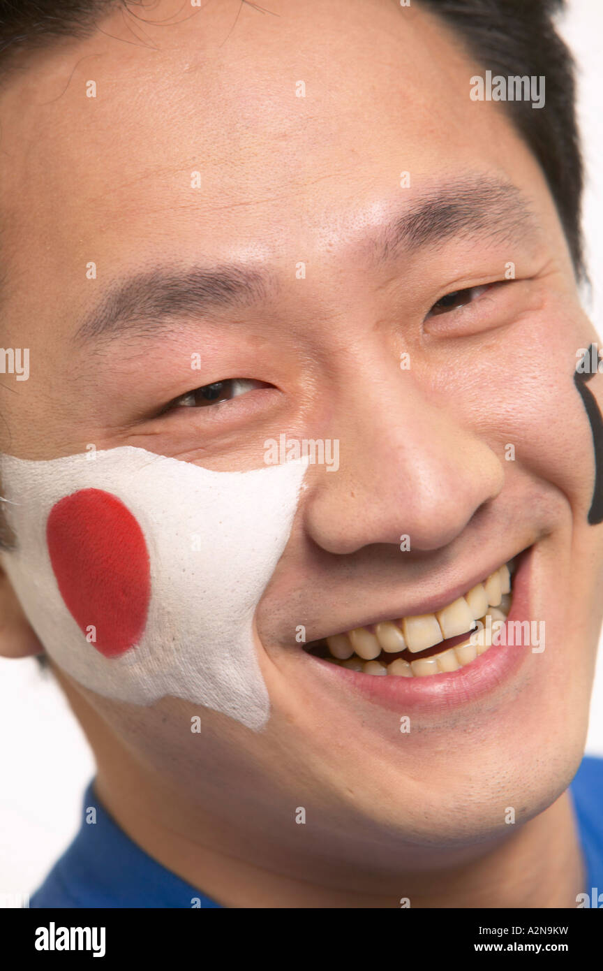 Portrait of young man with japanese painted flag on his face Stock ...