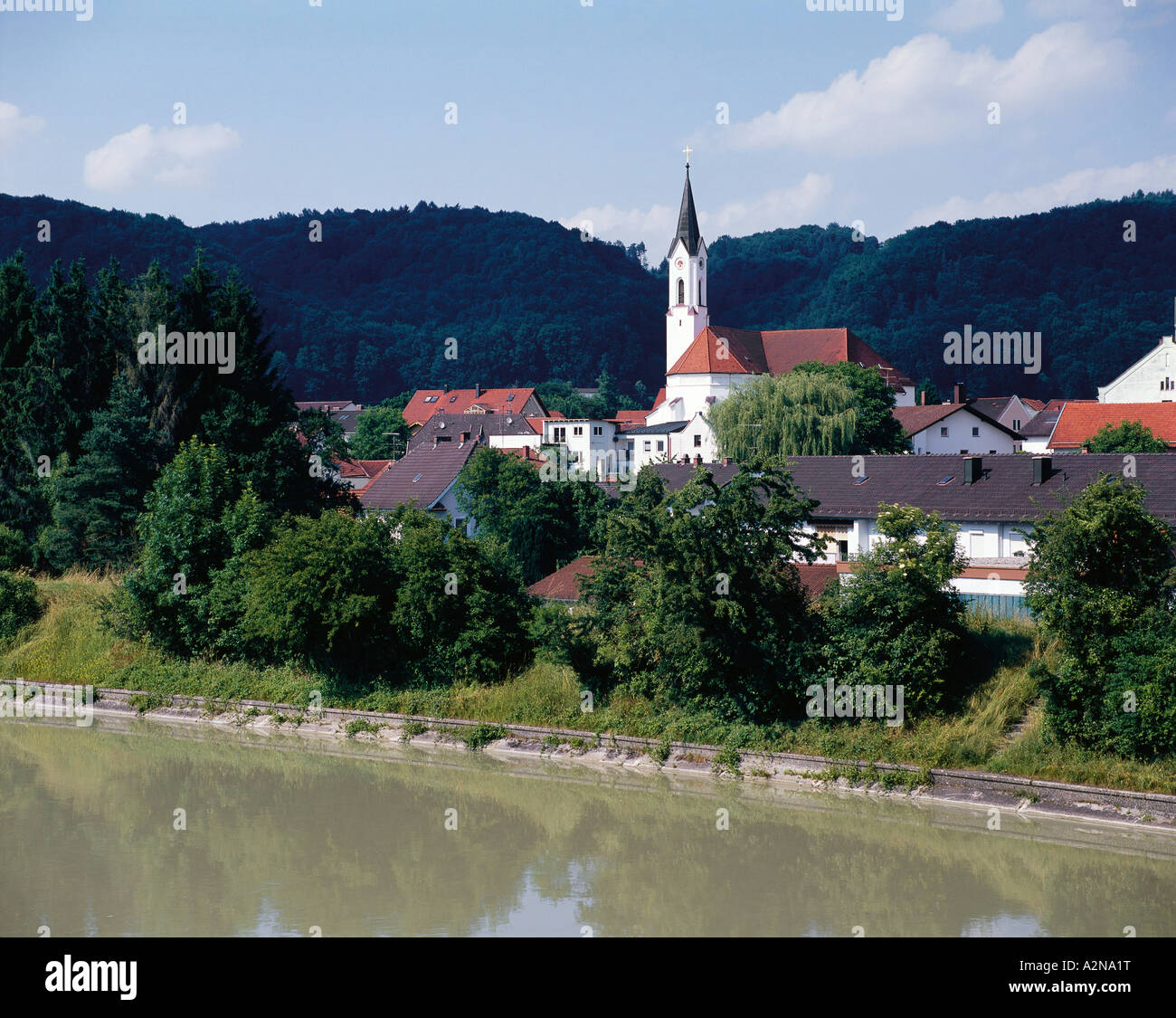 Church in a town at river side, Marktl, Bavaria, Germany Stock Photo ...