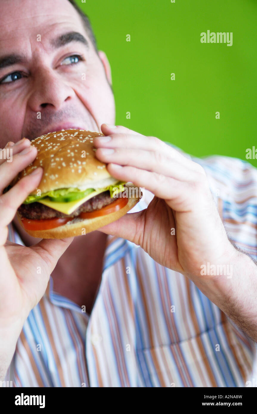 Man eating burger Stock Photo - Alamy