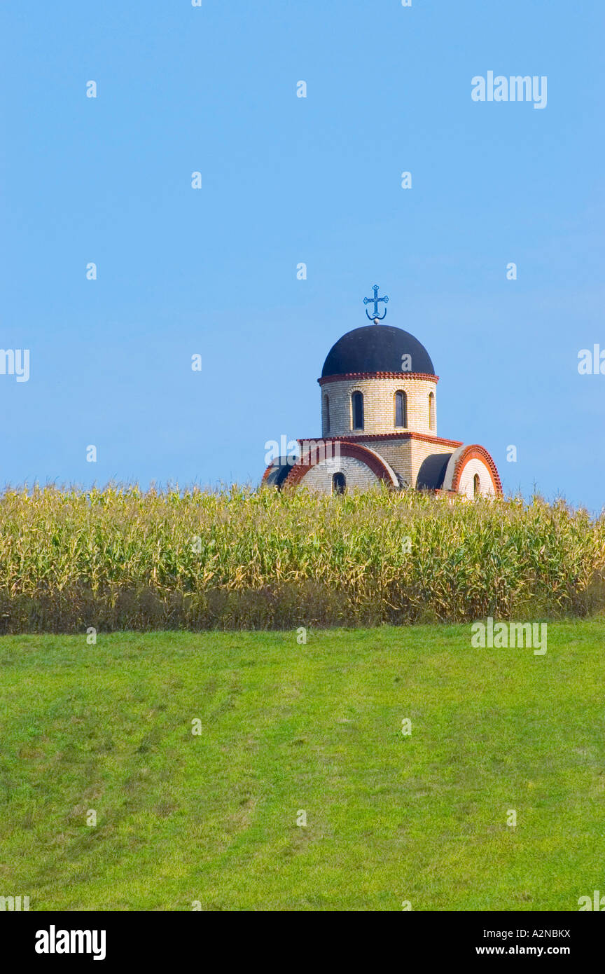 Field with church in background, Sandzak, Serbia Stock Photo - Alamy