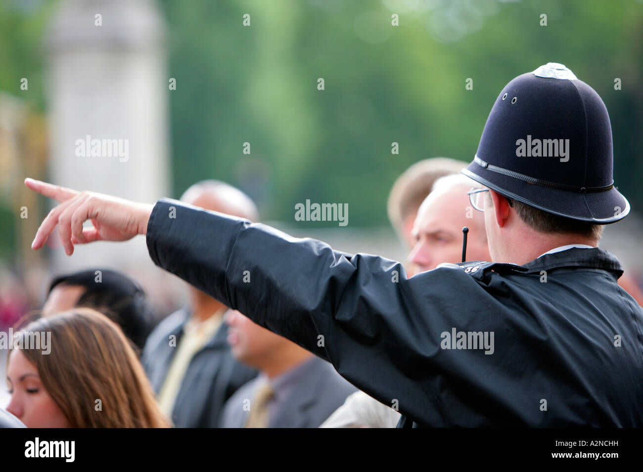 Policeman giving direction to tourists, London, England Stock Photo - Alamy