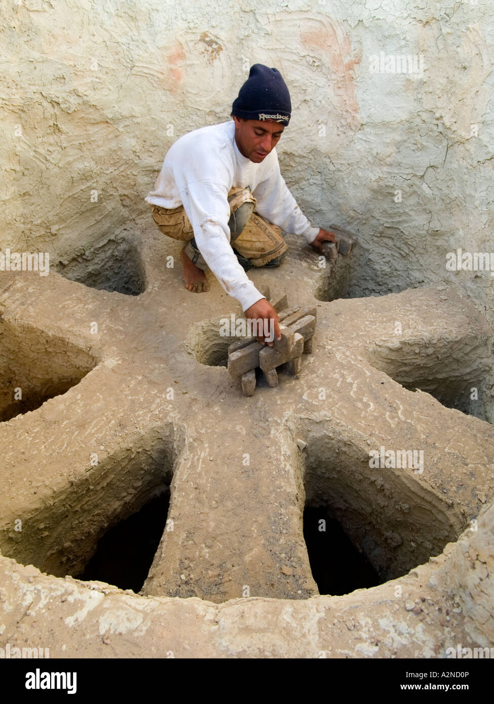 a Tunisian brick-maker starts to load his kiln Stock Photo - Alamy