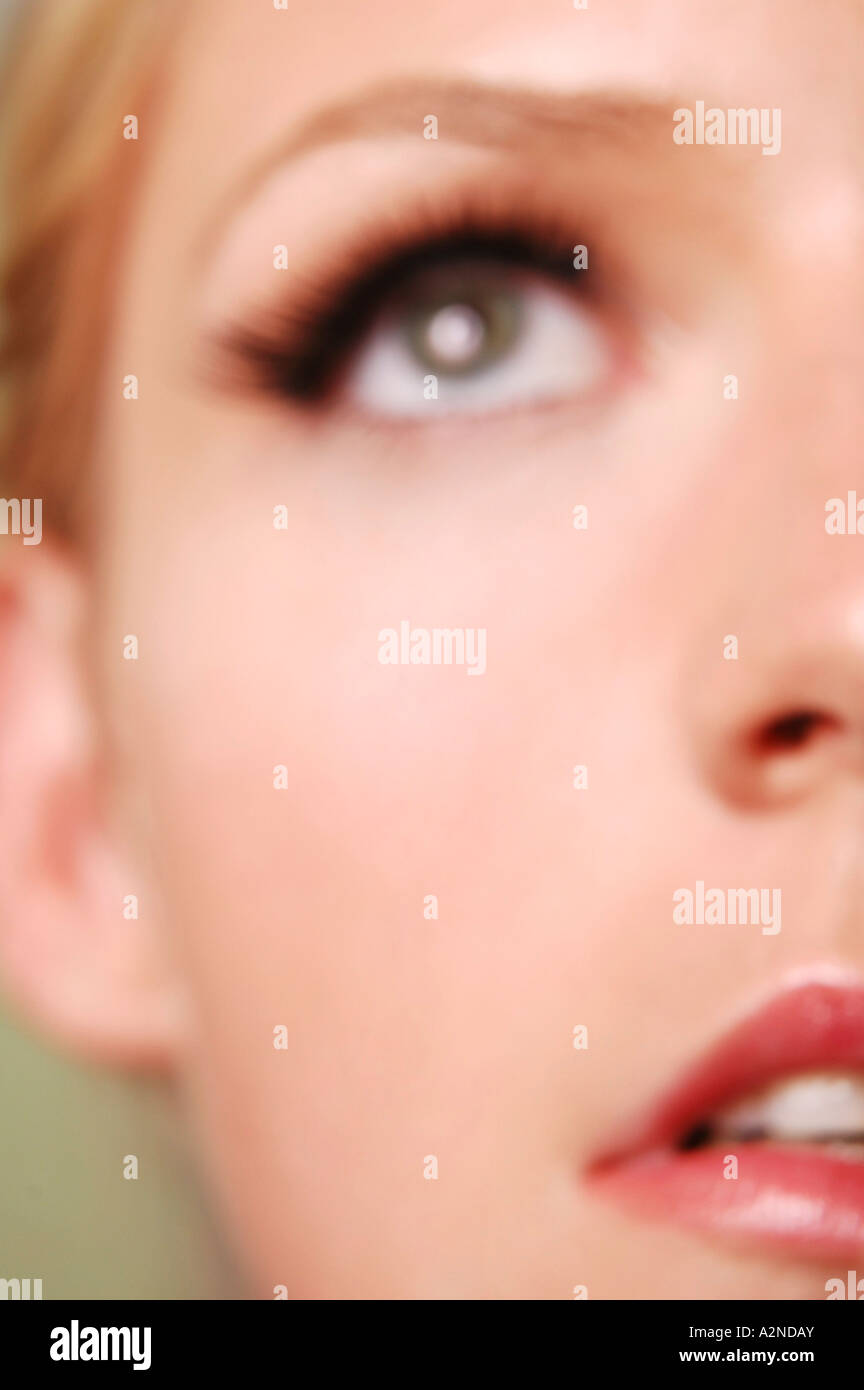 Young woman looking up close-up Stock Photo - Alamy