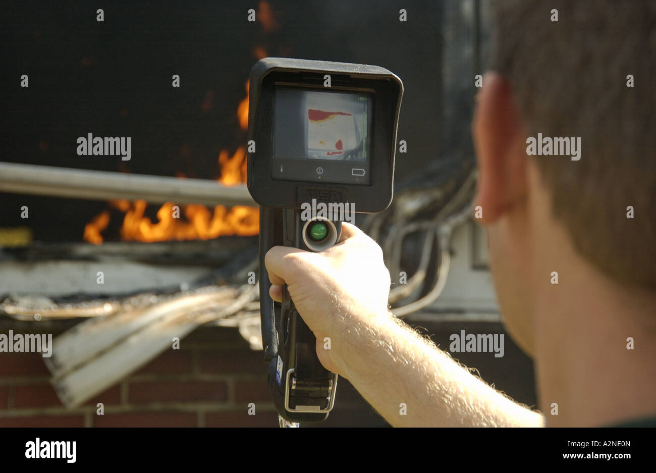 Close-up of fireman using firefighting equipment Stock Photo - Alamy
